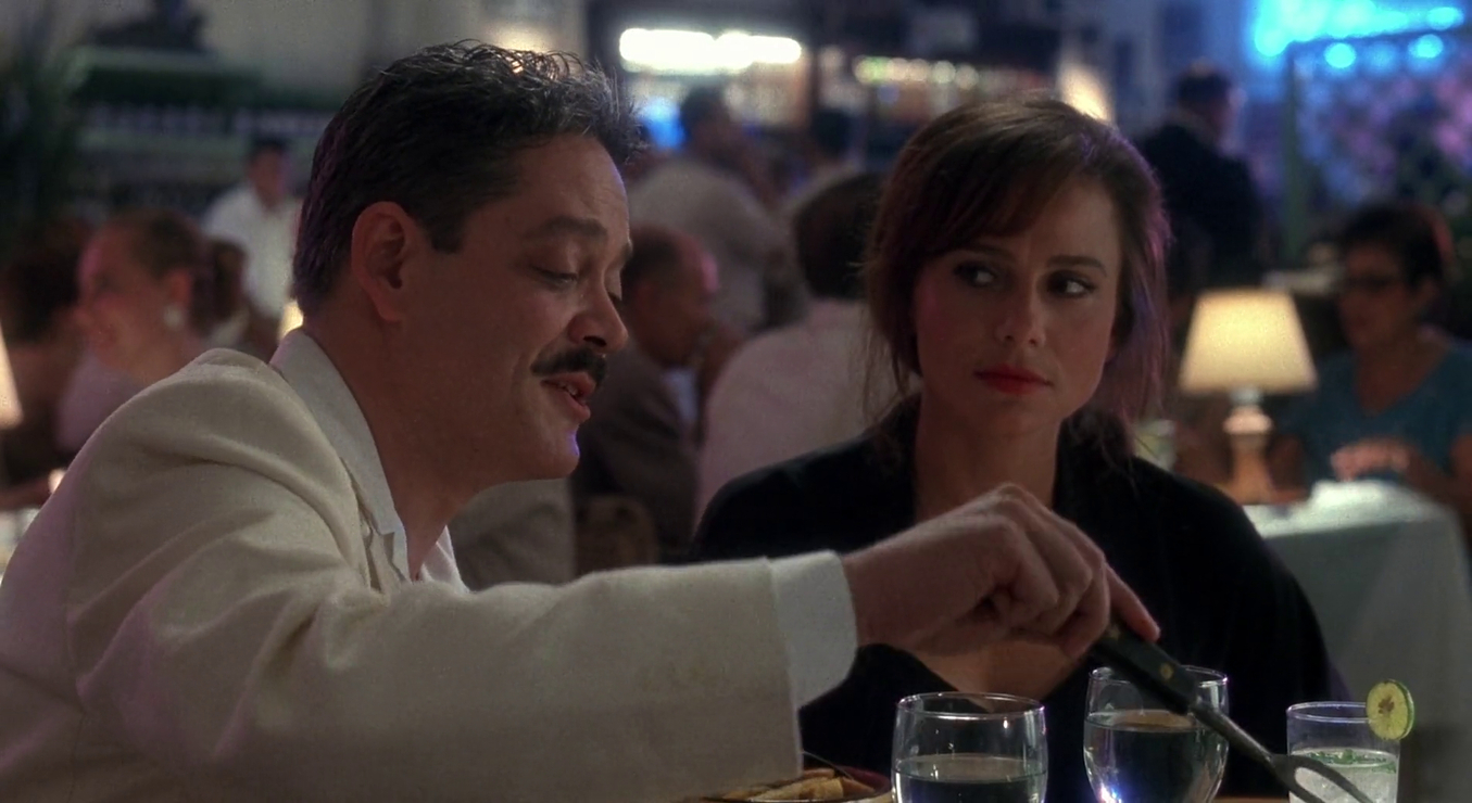 Raul Julia and Lena Olin
