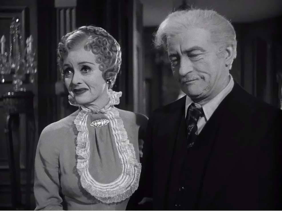Bette Davis and Claude Rains