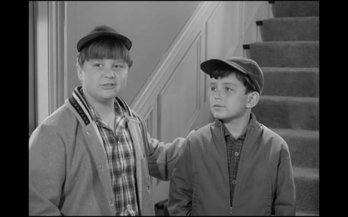 Rusty Stevens hugs Jerry Mathers as they want Wall